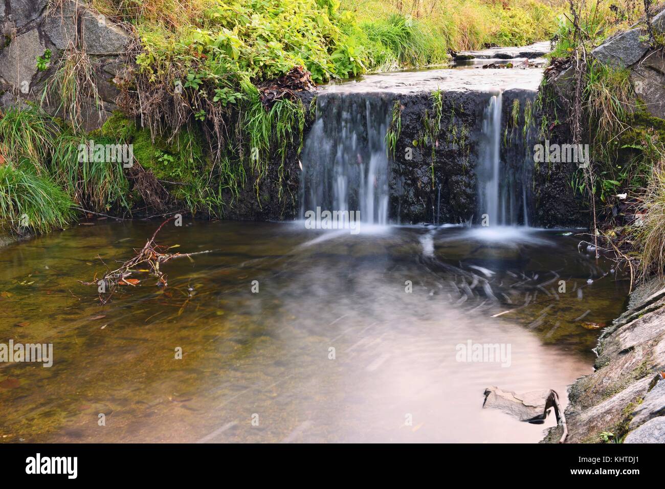 A beautiful clean brook in the countryside with a sink and running ...