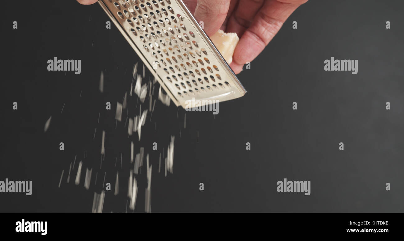 Chef grating parmesan over fresh hi-res stock photography and images ...