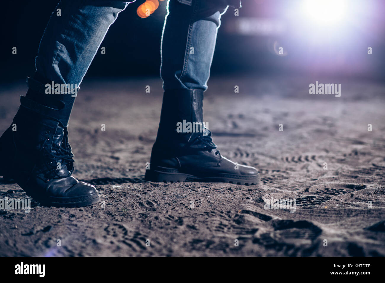 Serial maniac hand with bloody baseball bat closeup, car light at the ...