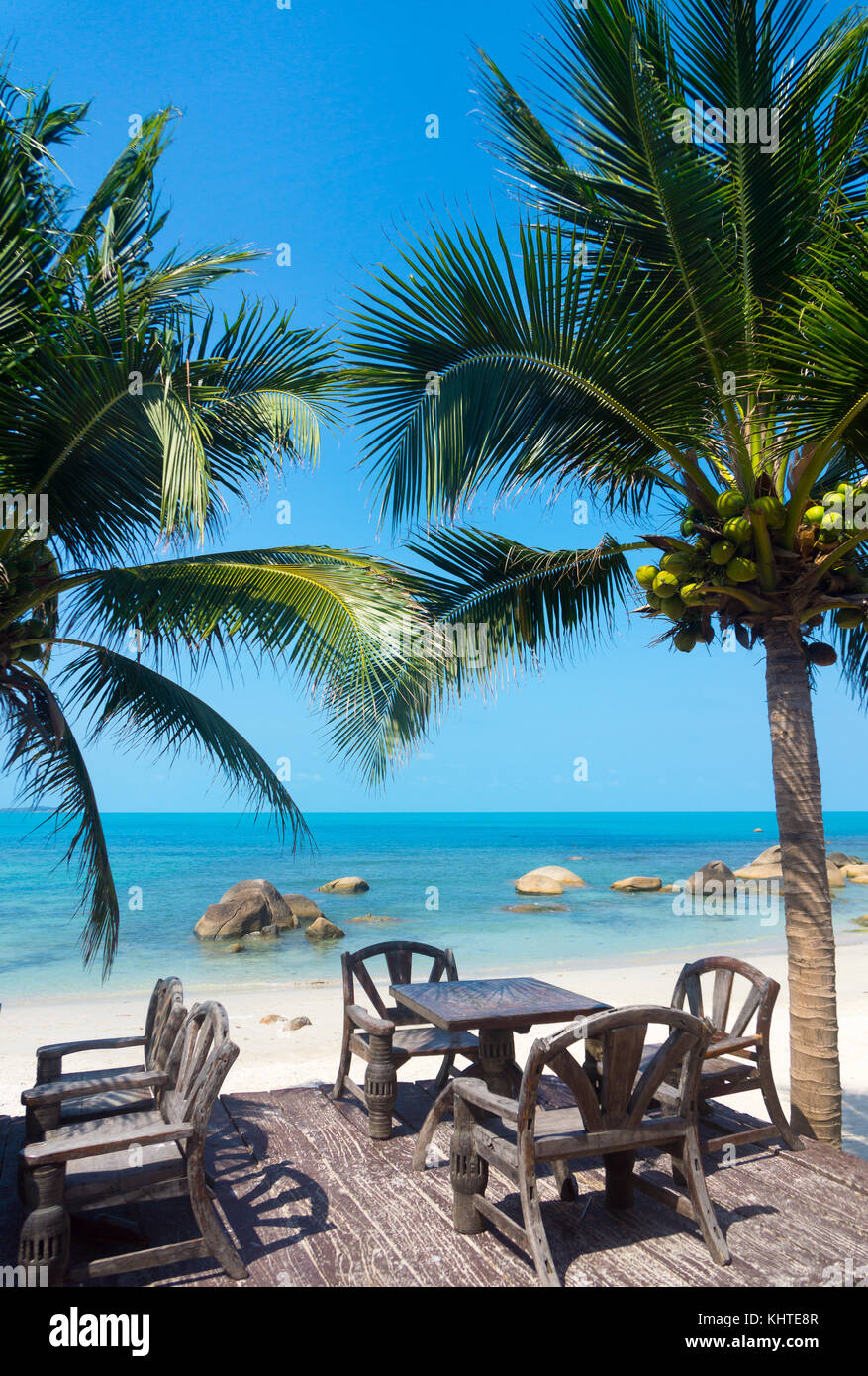 Table in a restaurant on the beach Stock Photo - Alamy
