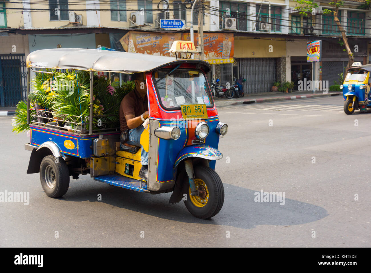 Unidentified man drives tuk tuk Stock Photo - Alamy