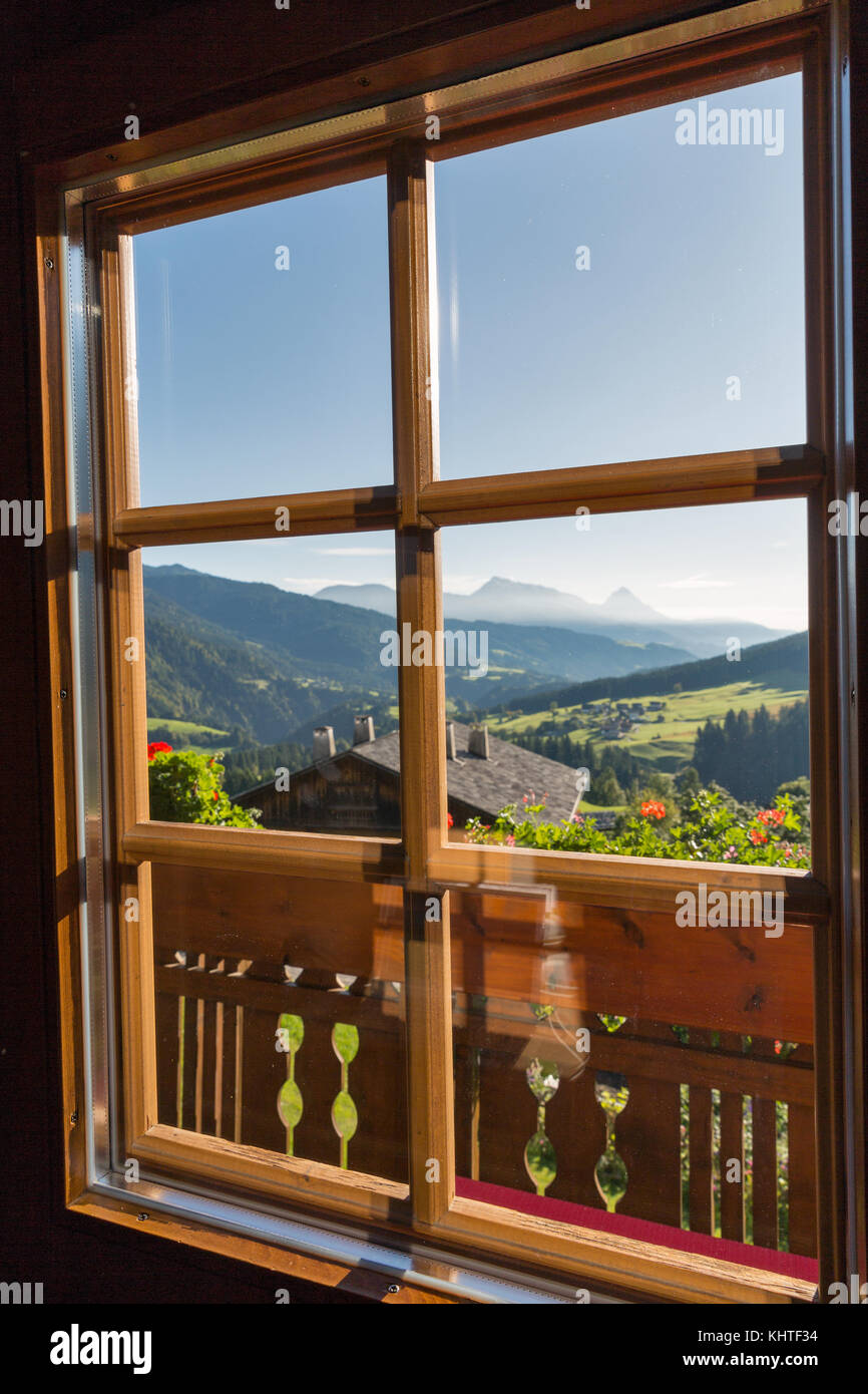 View through window towards the surrounding green mountains and Alpine ...