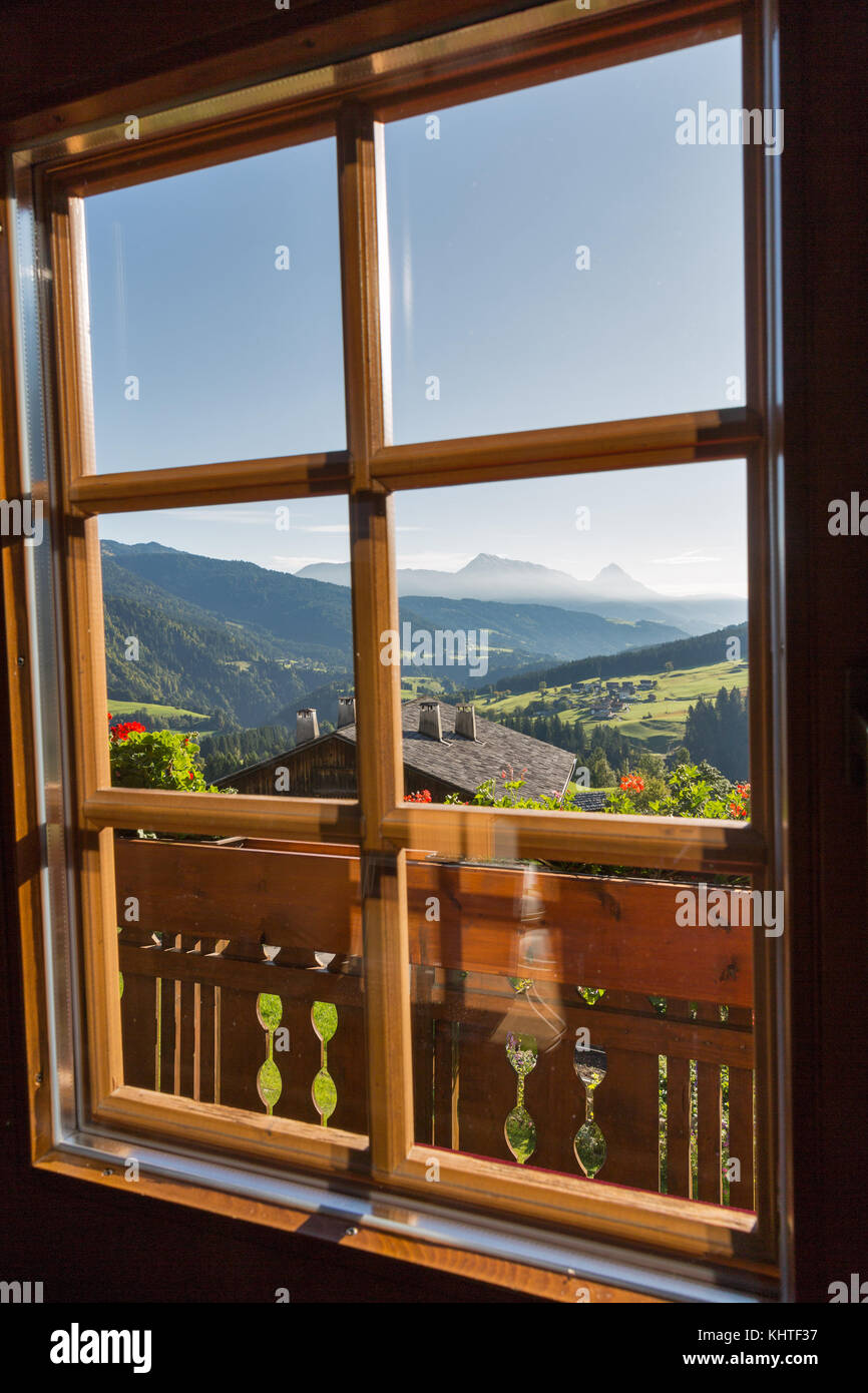 View through window towards the surrounding green mountains and Alpine ...