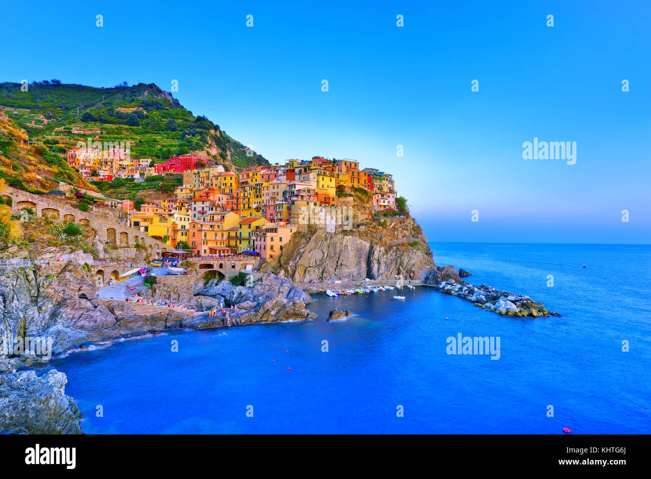 Manarola village along the coastline of Cinque Terre area at dusk in ...