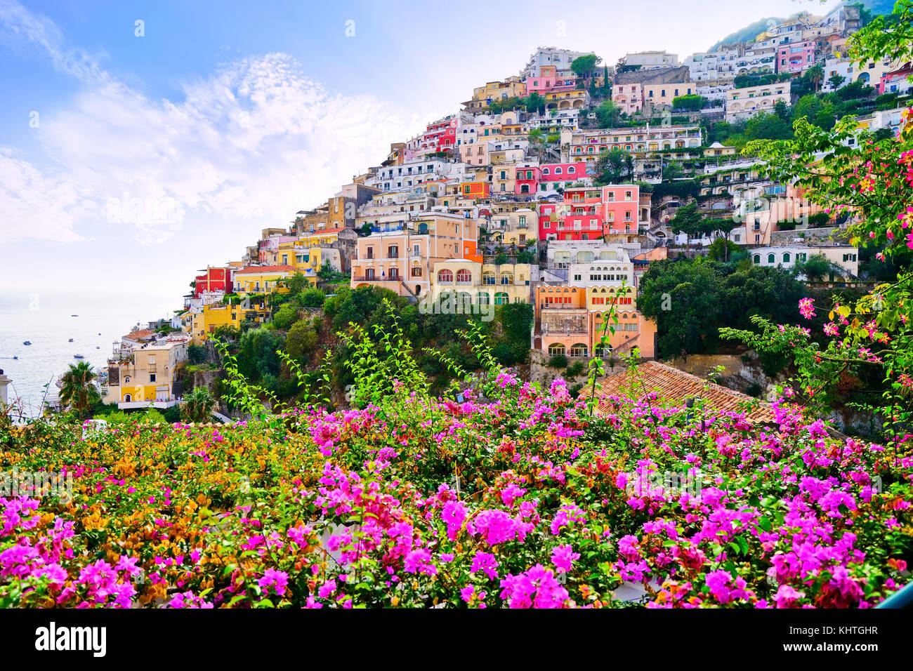 View of Positano village with purple flowers in summer in Italy Stock ...