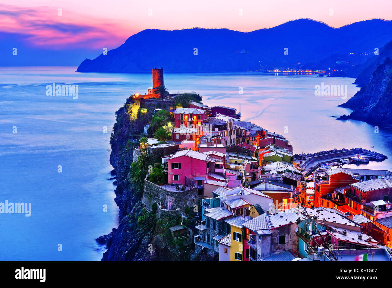 Vernazza village along the coastline of Cinque Terre area at dusk in ...