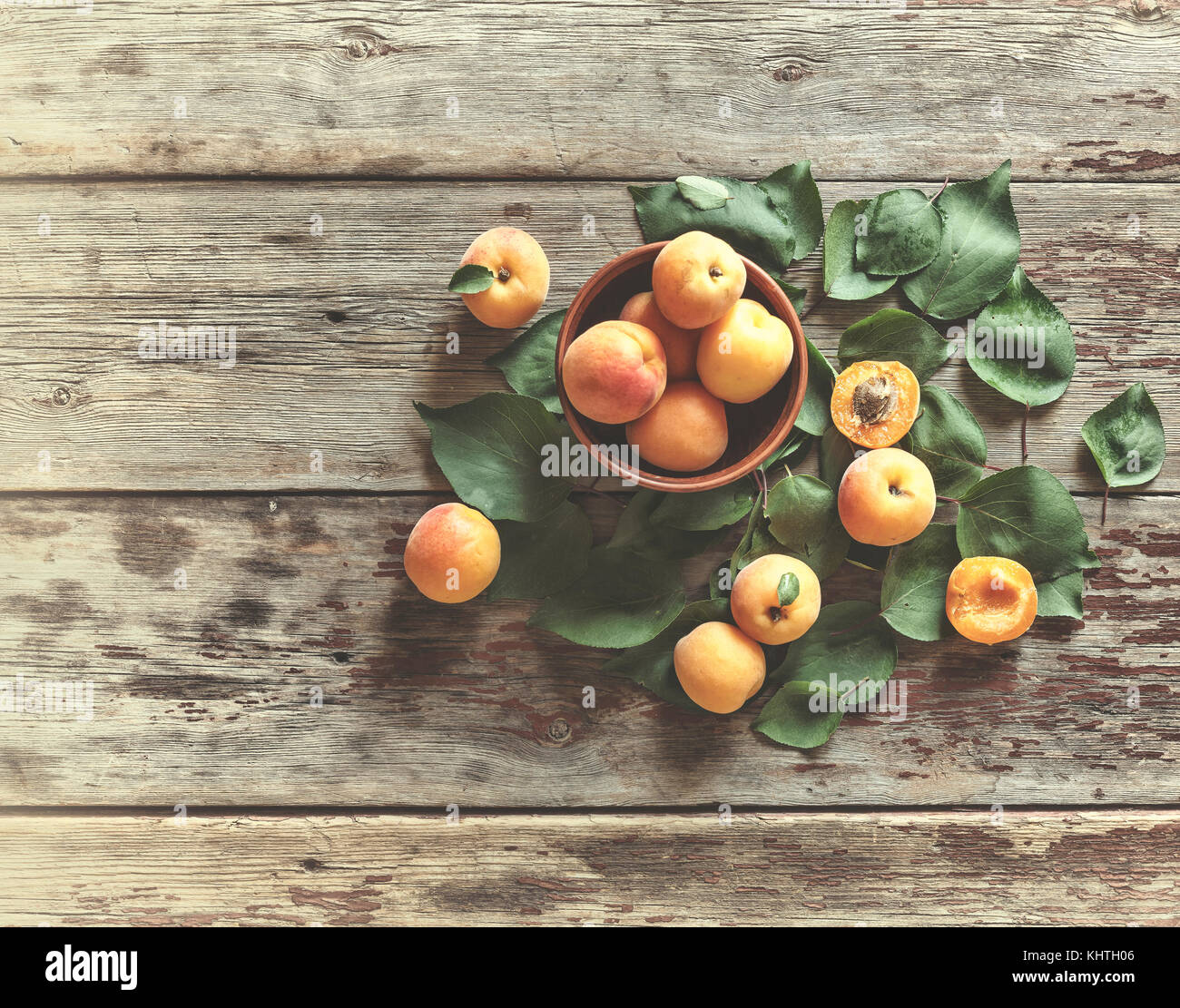 Ripe apricots on a wooden background. Vintage. Top view Stock Photo - Alamy