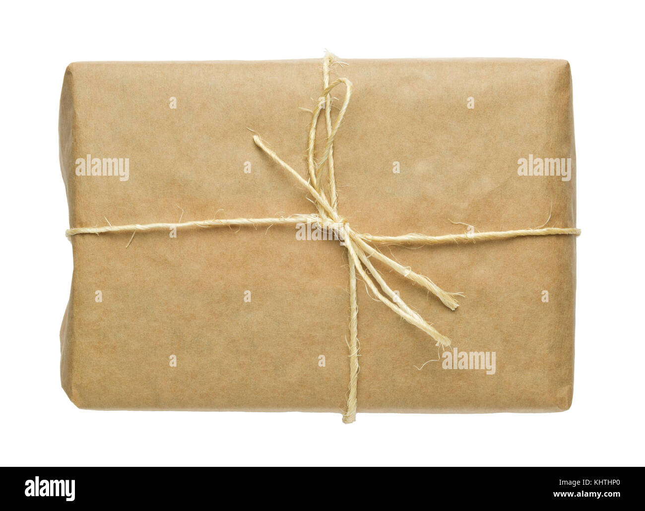 Parcel wrapped in brown paper and tied with rough twine Stock Photo - Alamy