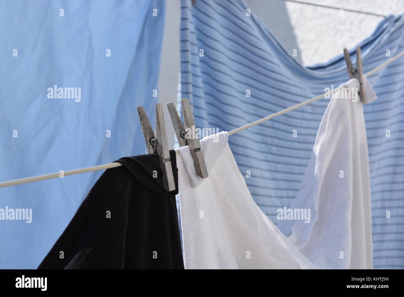 Laundry day. Washing hanging on the line, drying in the sun Stock Photo ...