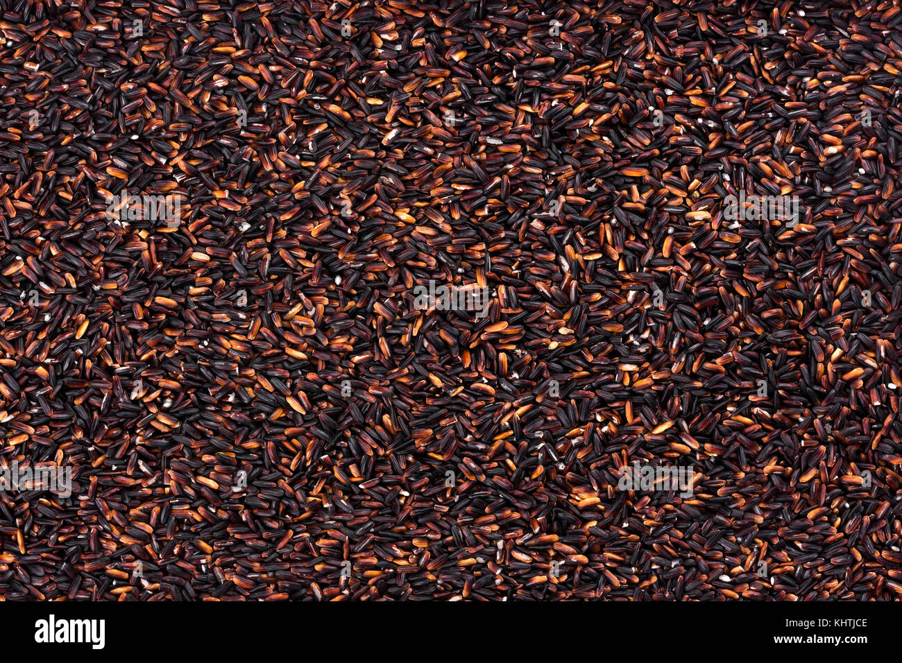 Black rice background or texture Stock Photo - Alamy