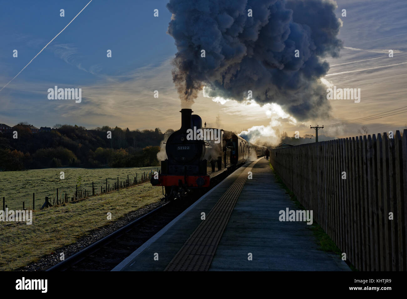 Steam train, black 0 6 0 locomotive pulling carriages arriving at burrs ...
