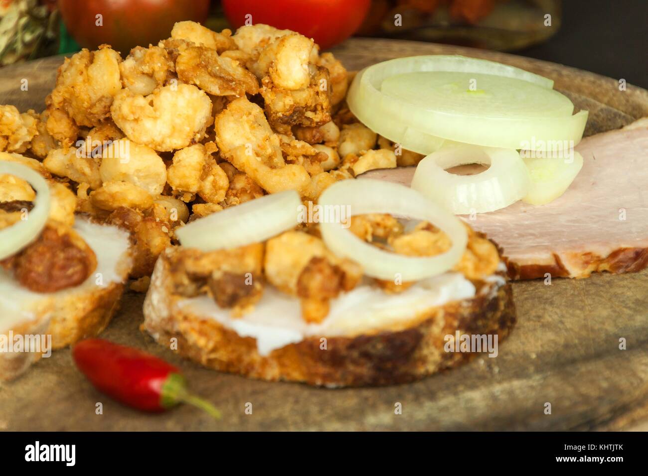 Heap of domestic salty fried pork greaves. Fatty junk food. Pork ...