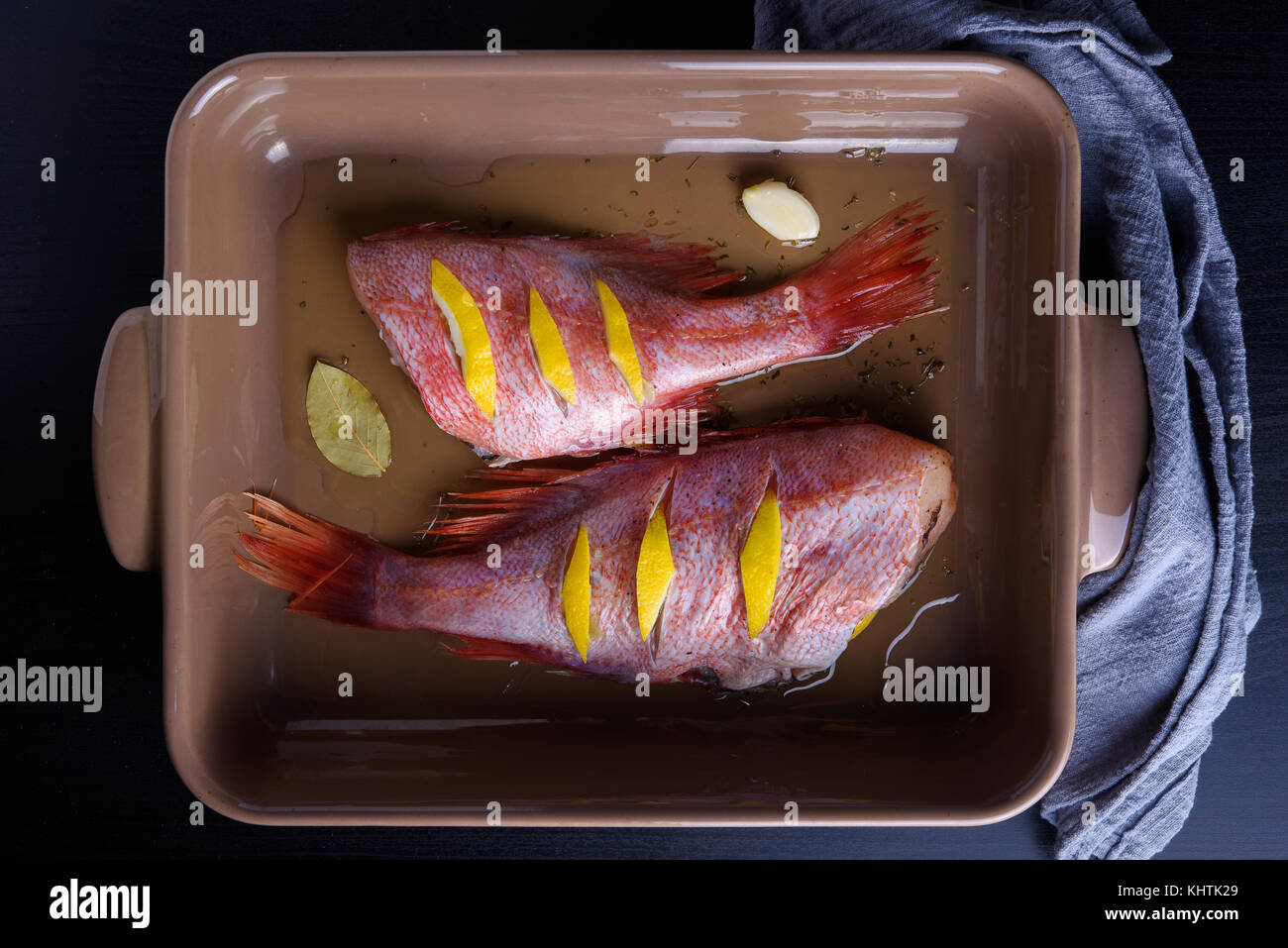 Uncooked raw red sea perch or red grouper with lemon. Top view Stock ...