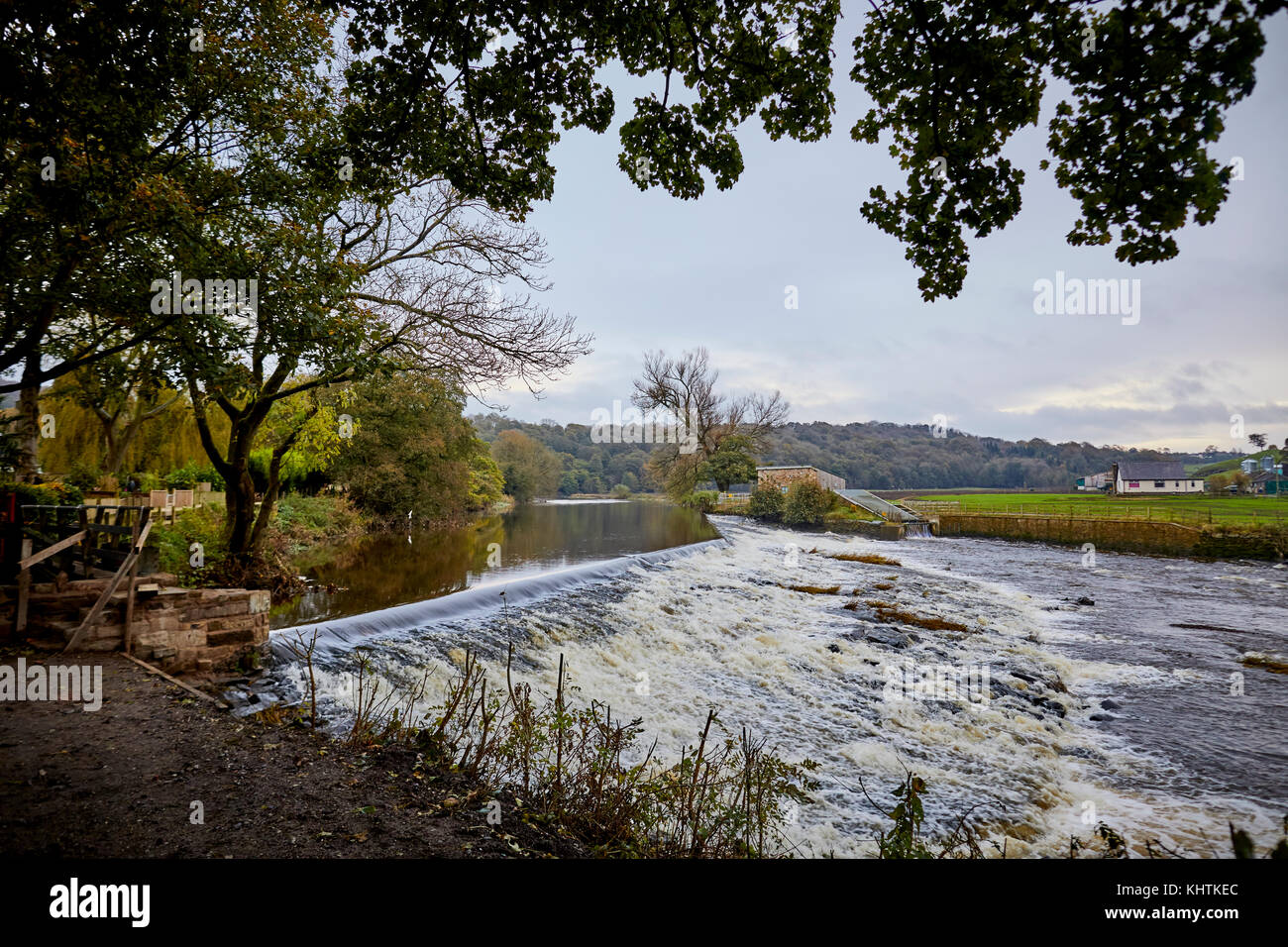 Autumn in Ribble Valley village Whalley in Lancashire, a small weir on ...