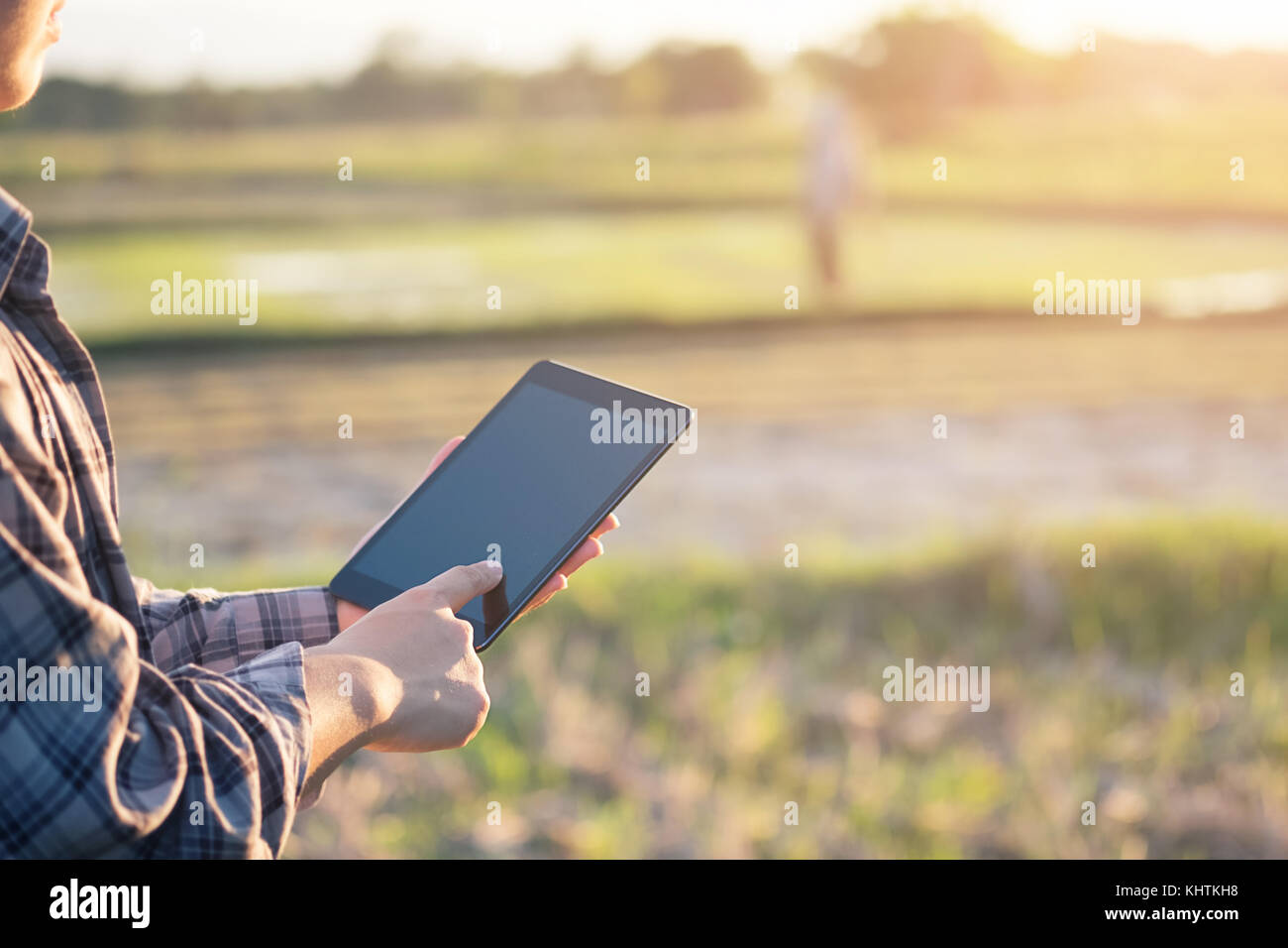 agriculture technology, farmer using tablet on agriculture field and ...