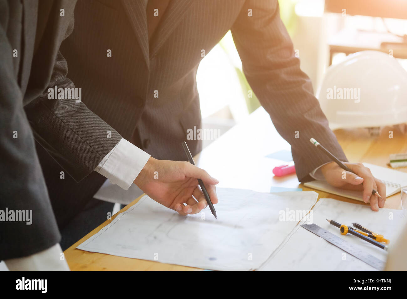 Two business Engineer discussing meeting architectural project working ...