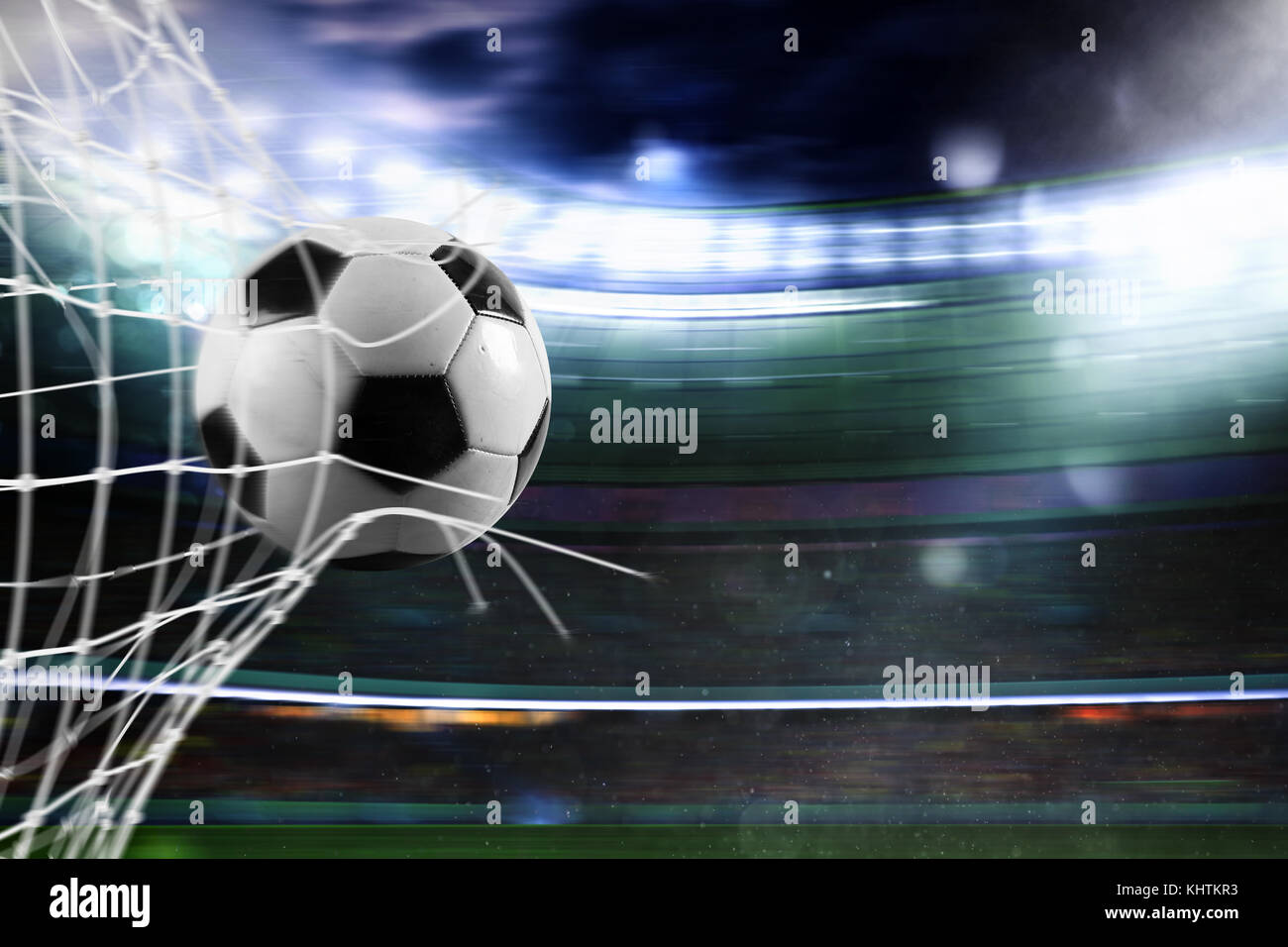 Soccer ball scores a goal on the net Stock Photo - Alamy