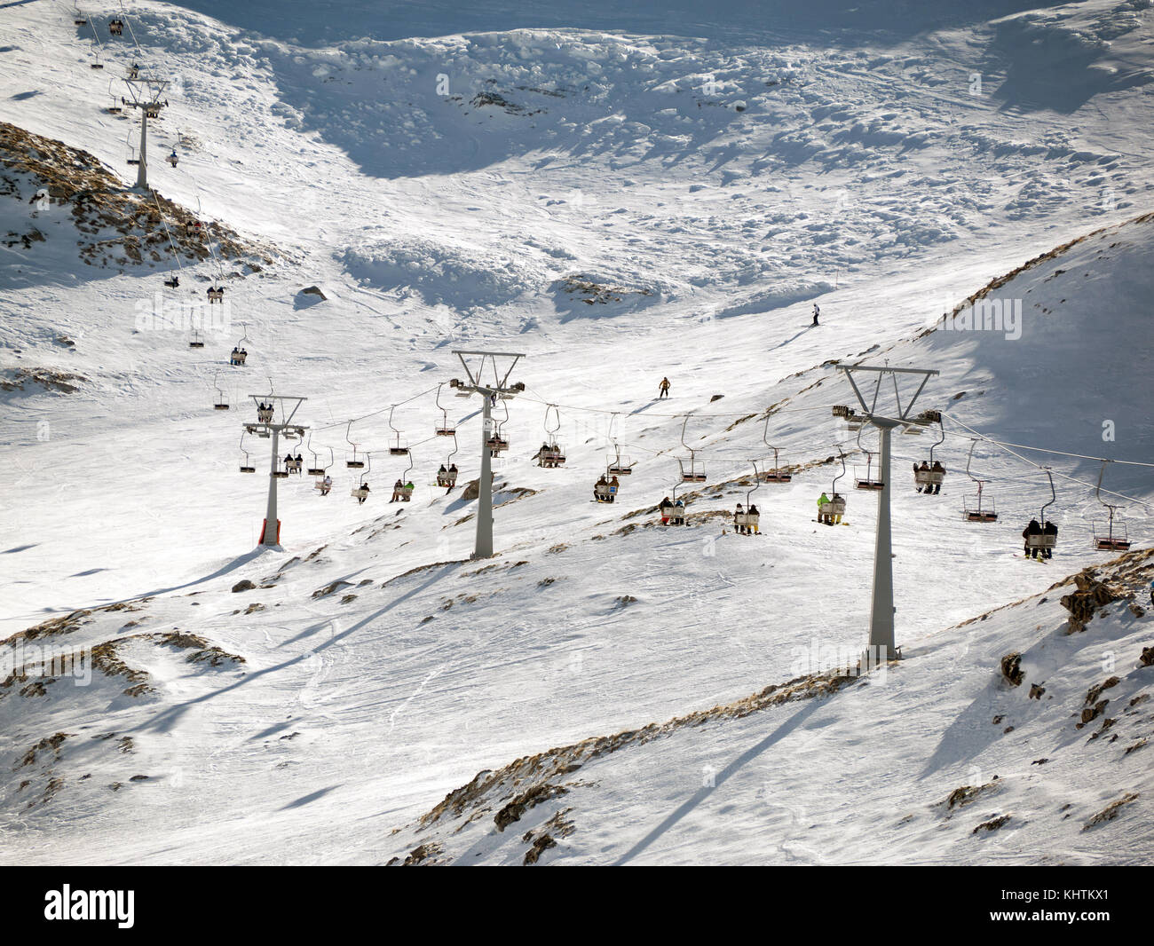 ski lift on the slope of a big ski resort Stock Photo - Alamy