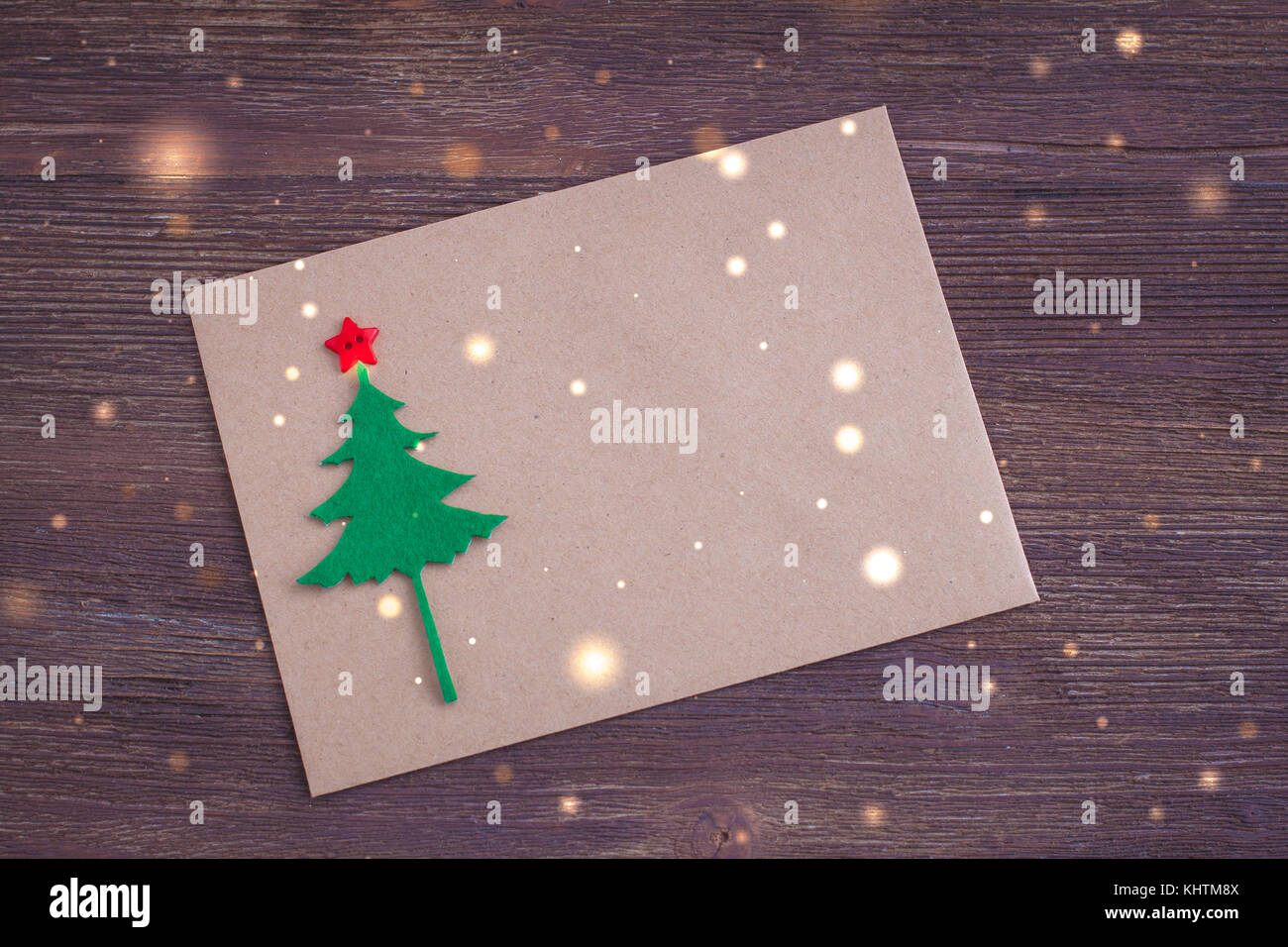 Signing Christmas card with felt Christmas-tree, snowflakes effect and ...