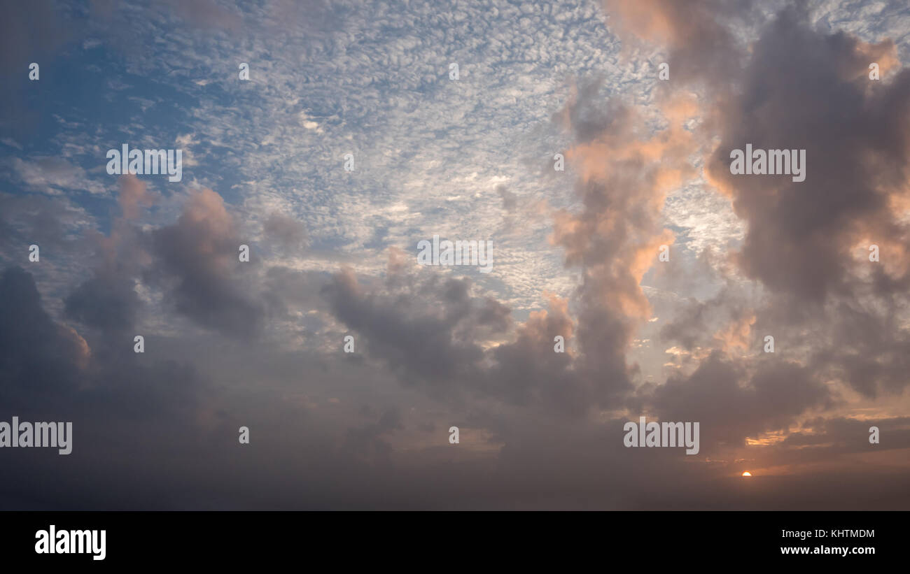 Looking up to Storm Clouds Clearing With Sunrising Stock Photo - Alamy