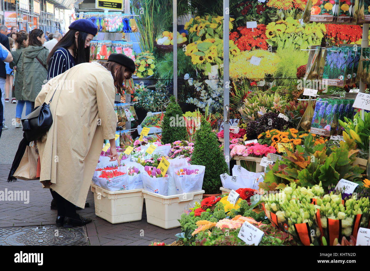Friends shopping at the world famous floating flower market on the ...
