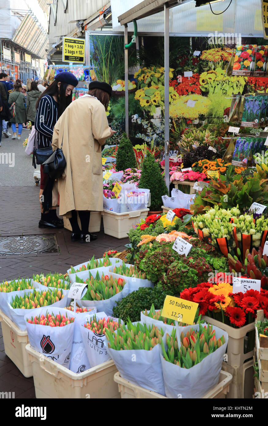 Friends shopping at the world famous floating flower market on the ...