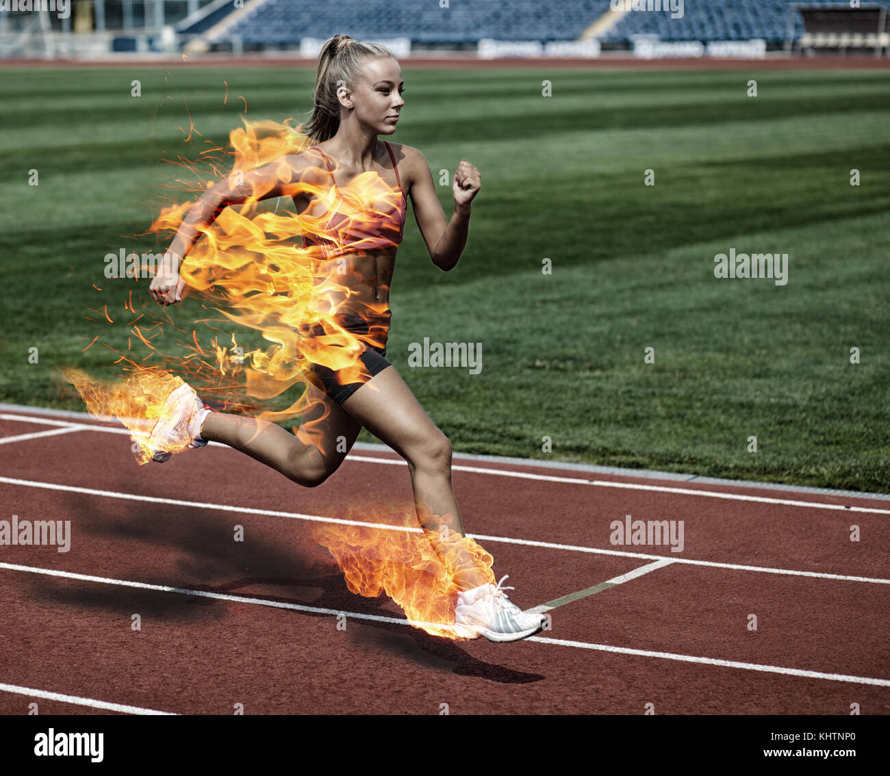 Sporty woman in fire Stock Photo - Alamy