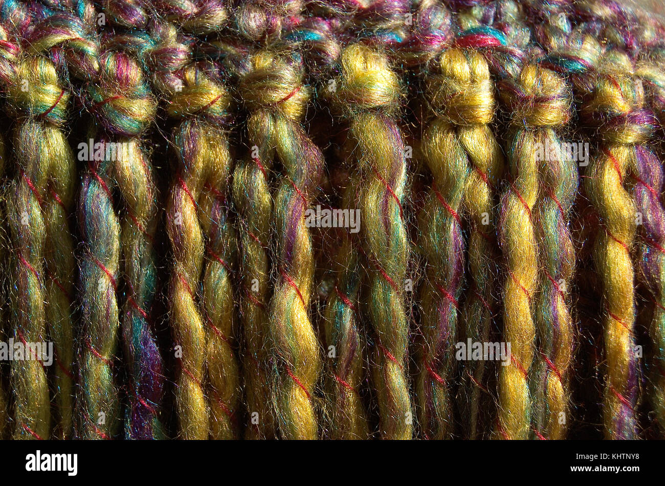 Closeup of beautiful textured yarn with tassels tied in knots Stock ...