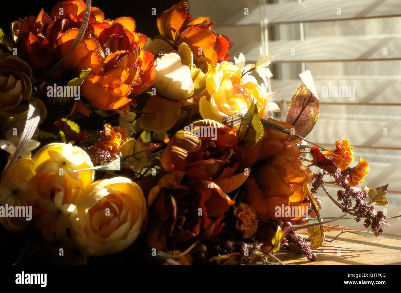 Flower bouquet by a window with shades and afternoon shadows Stock ...