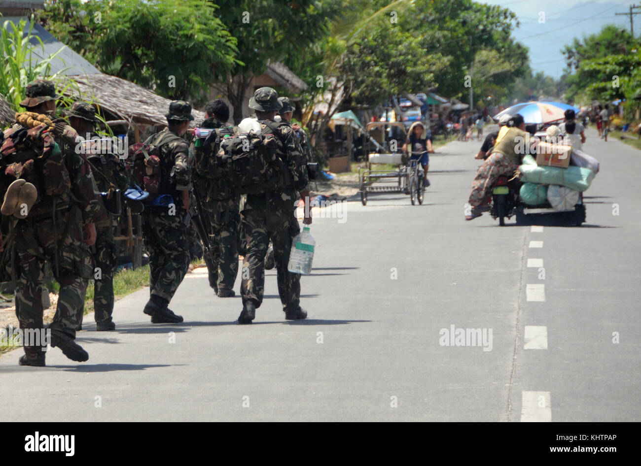 Taking refuge. The photo shows people fleeing their homes as the ...