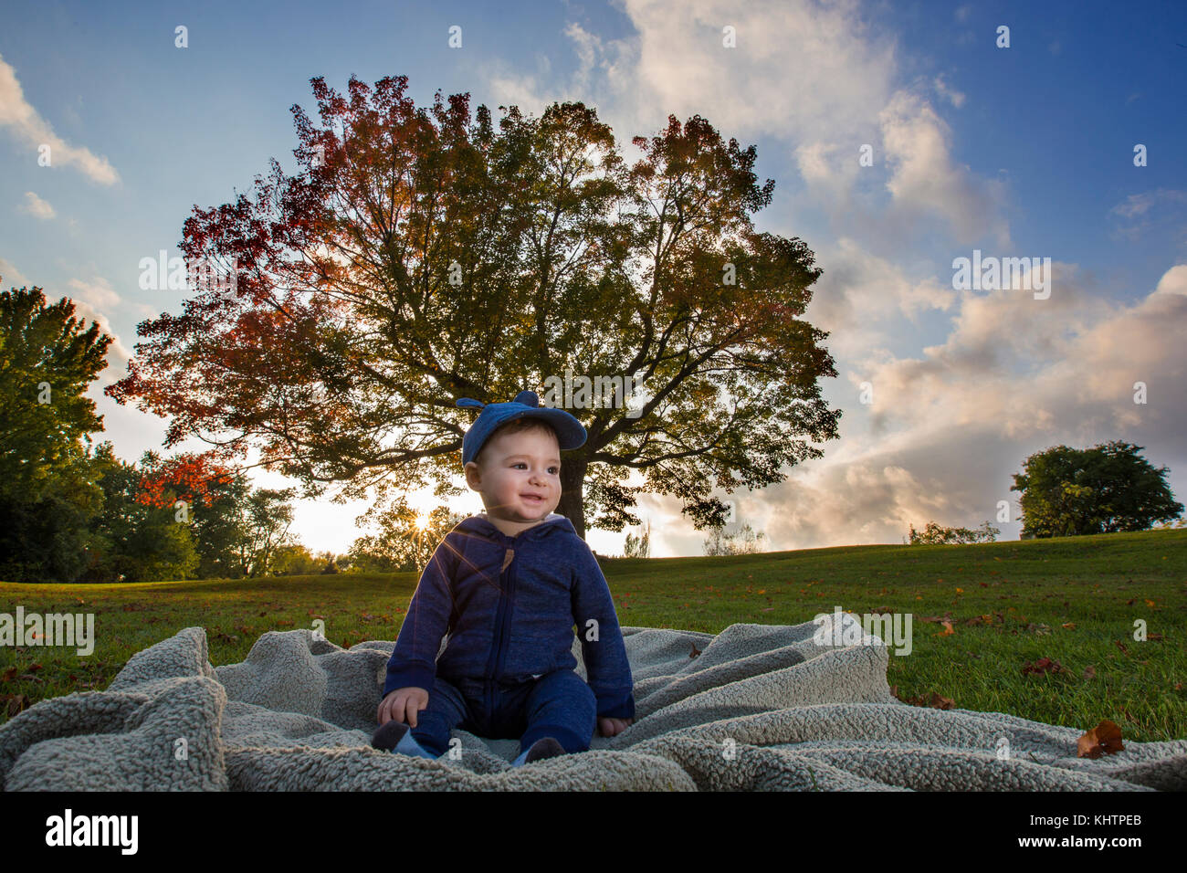 Baby boy in fall forest Stock Photo - Alamy