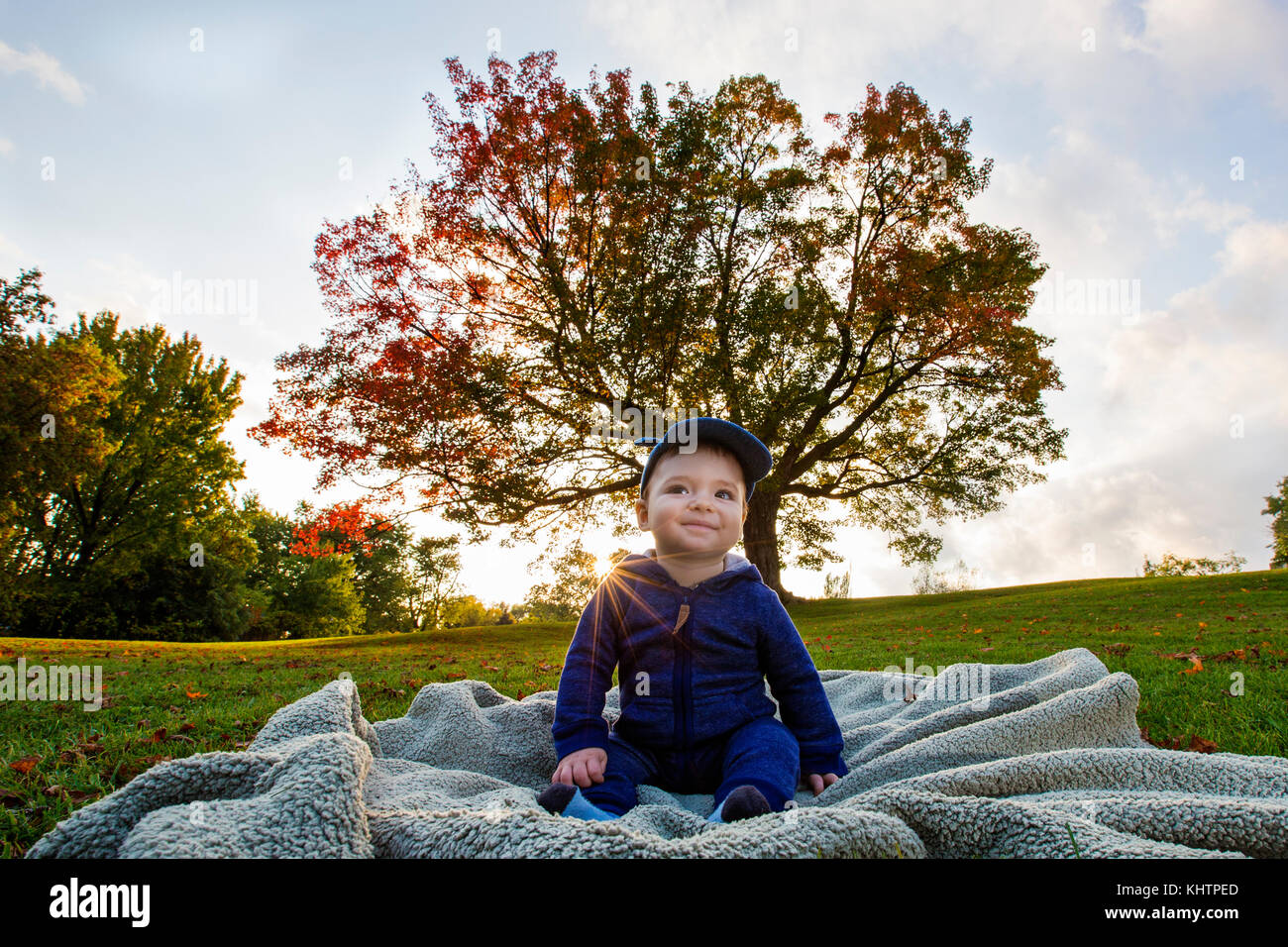 Baby boy in fall forest Stock Photo - Alamy
