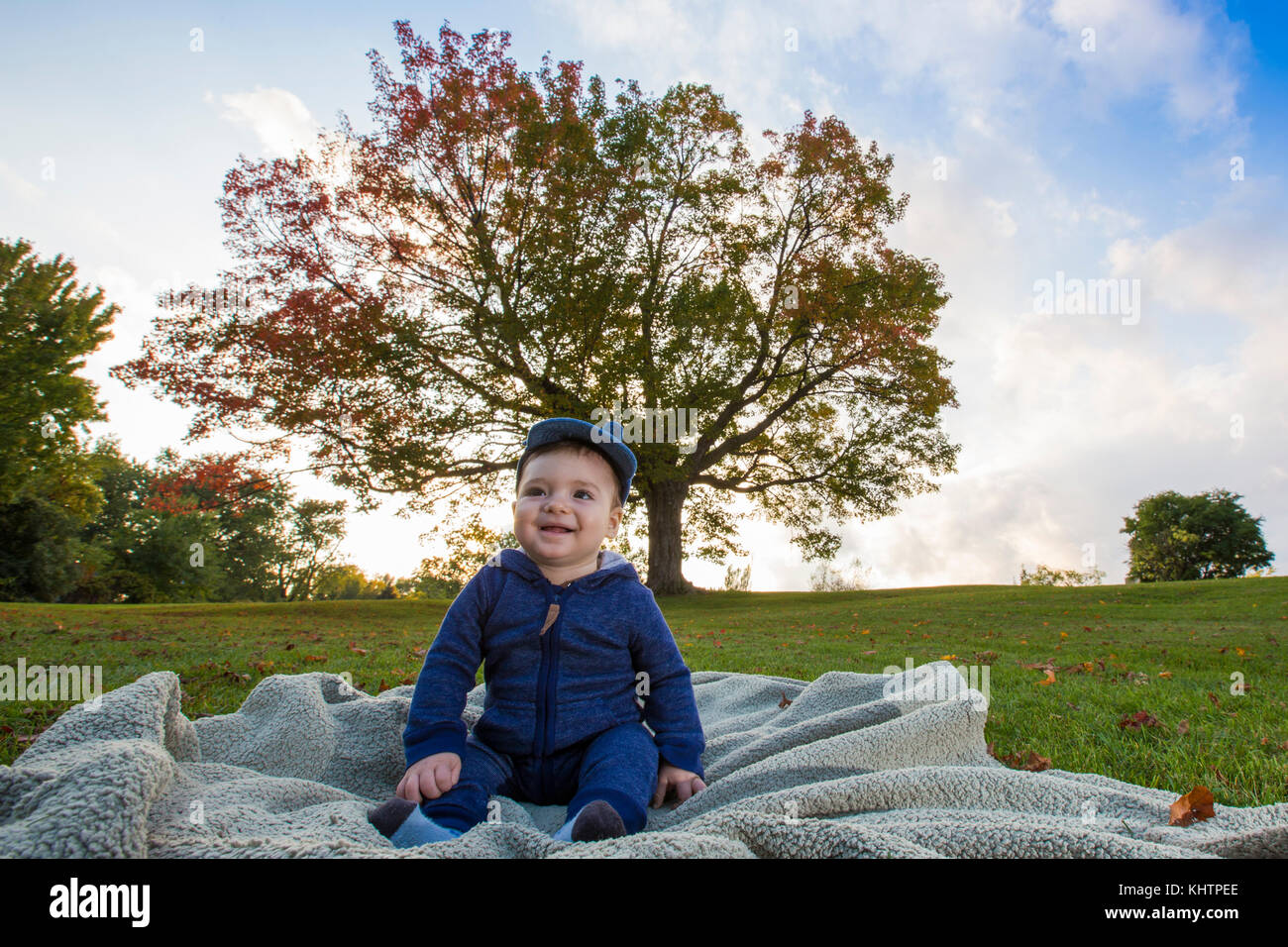 Baby boy in fall forest Stock Photo - Alamy