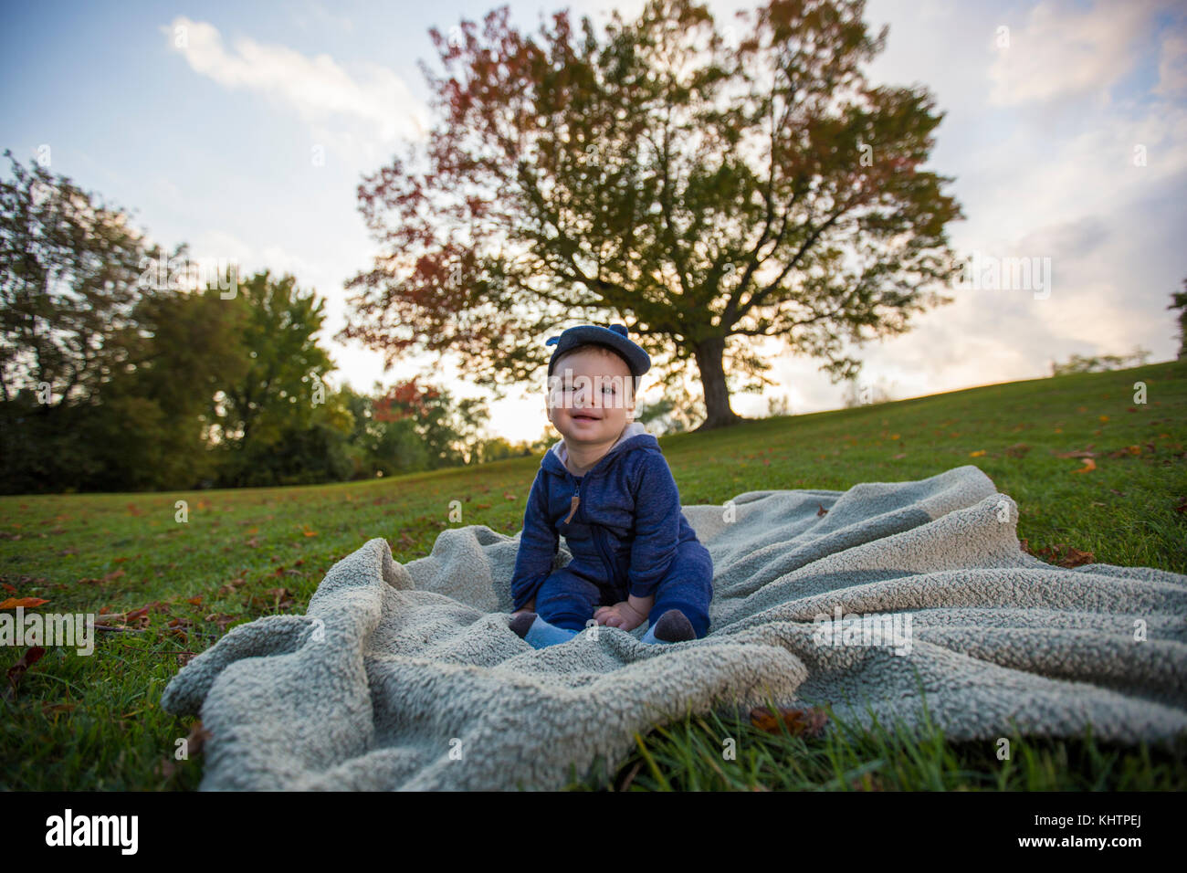 Baby boy in fall forest Stock Photo - Alamy