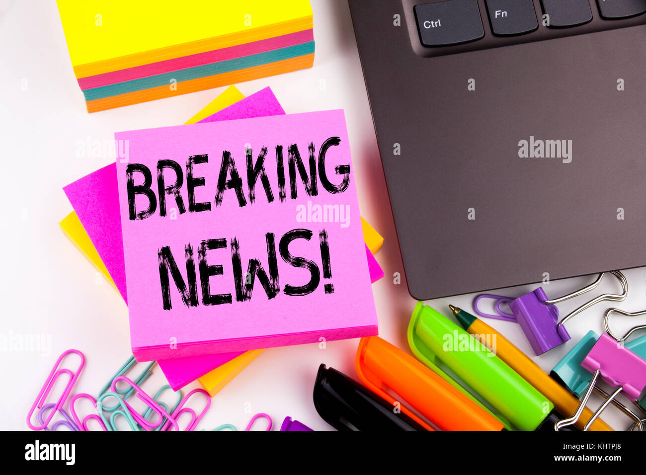 Writing text showing Breaking News made in the office with surroundings ...