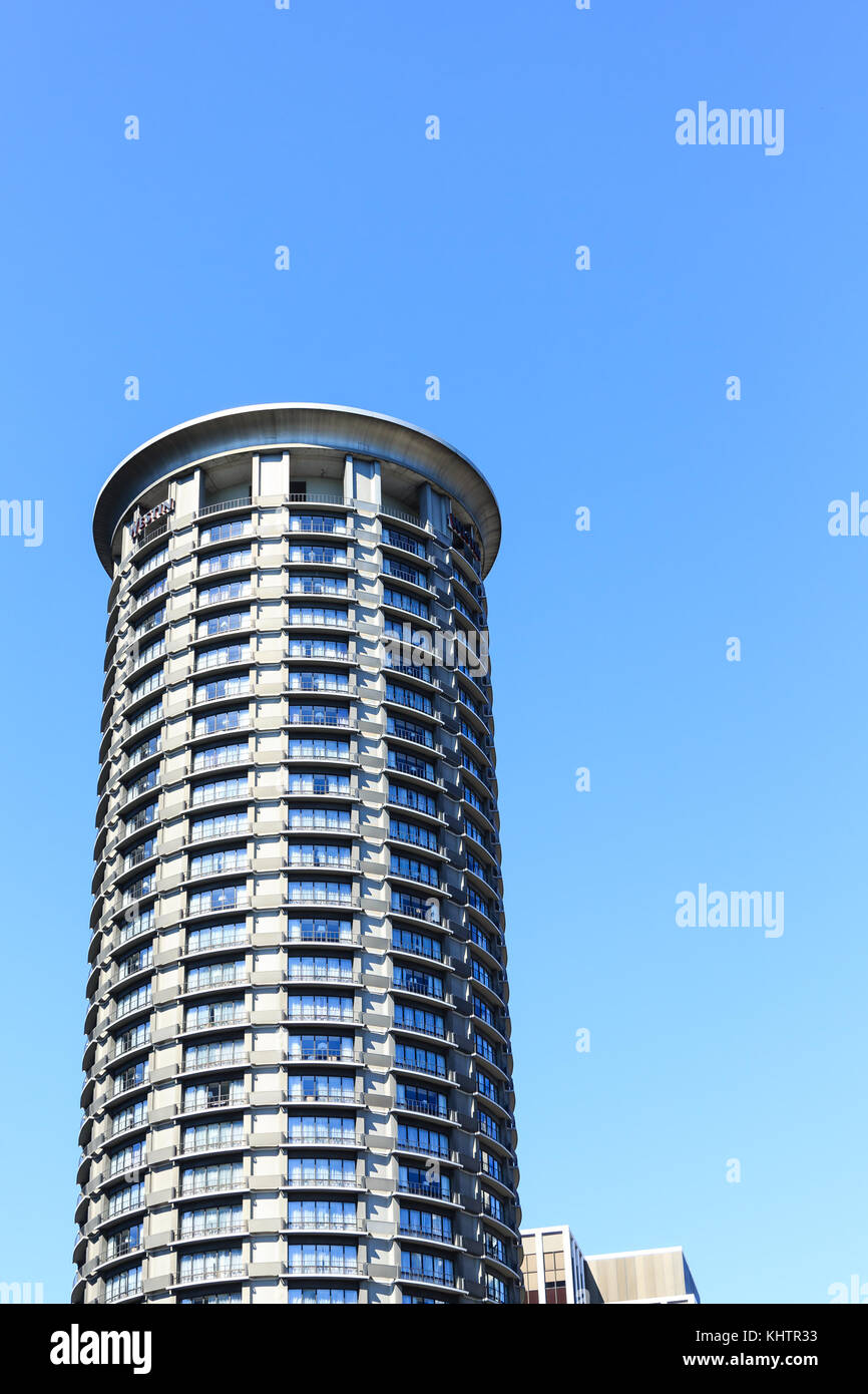 Round condo Tower Rising into Blue Sky in Seattle Stock Photo - Alamy