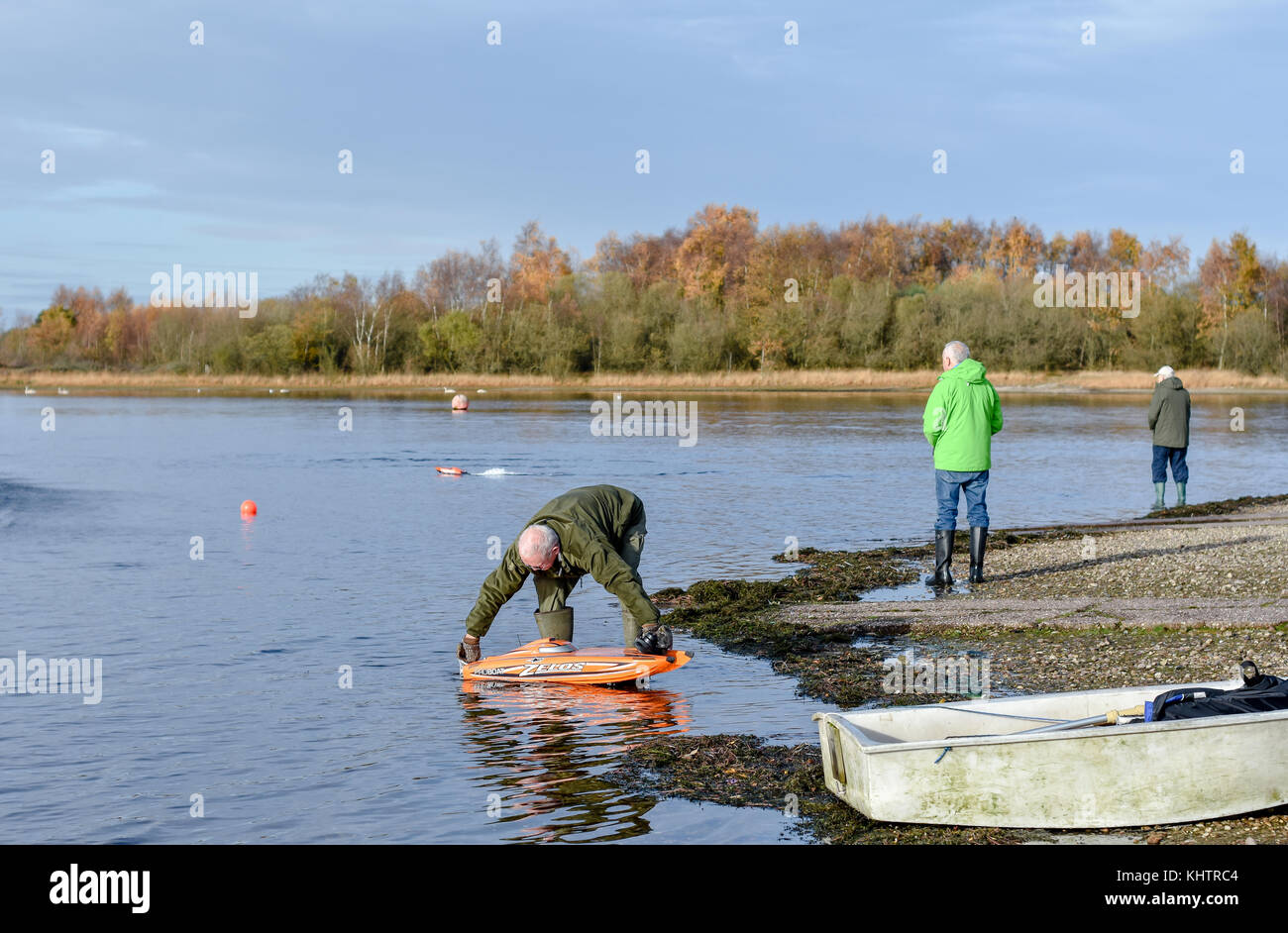 Men playing with remote control speedboats on Chasewater Country Park ...