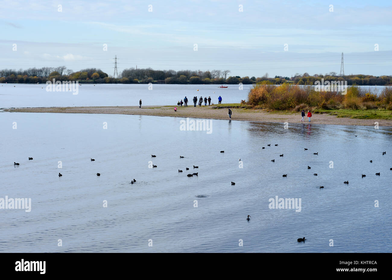 People enjoying an autumn walk along the shoreline of Chasewater ...
