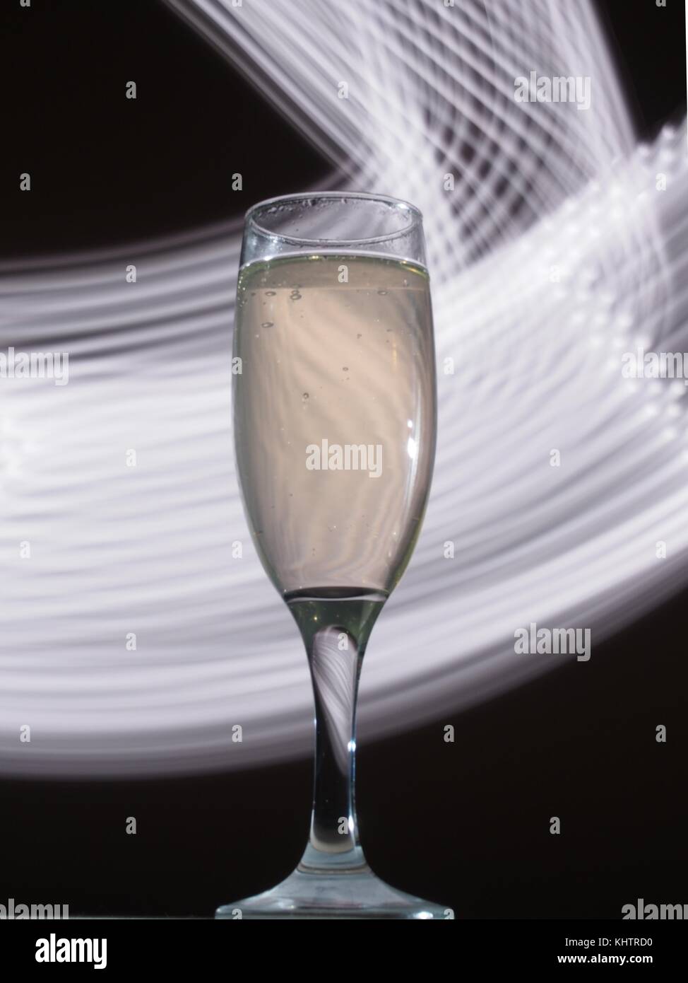 Glass of champagne on the background lights. Illumination of a night ...