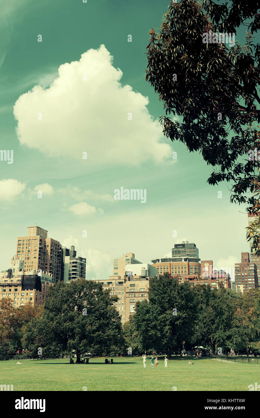Central Park Spring with skyline in midtown Manhattan New York City ...