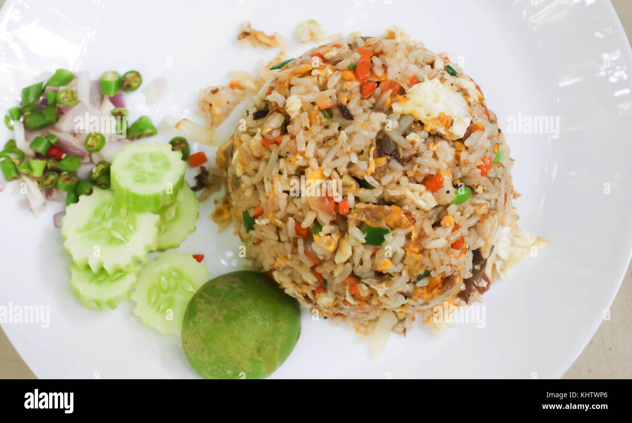 Closeup of Fried rice thai style on the white plate Stock Photo - Alamy
