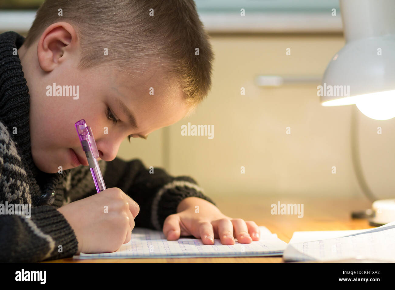Child school age boy making his homework Stock Photo - Alamy