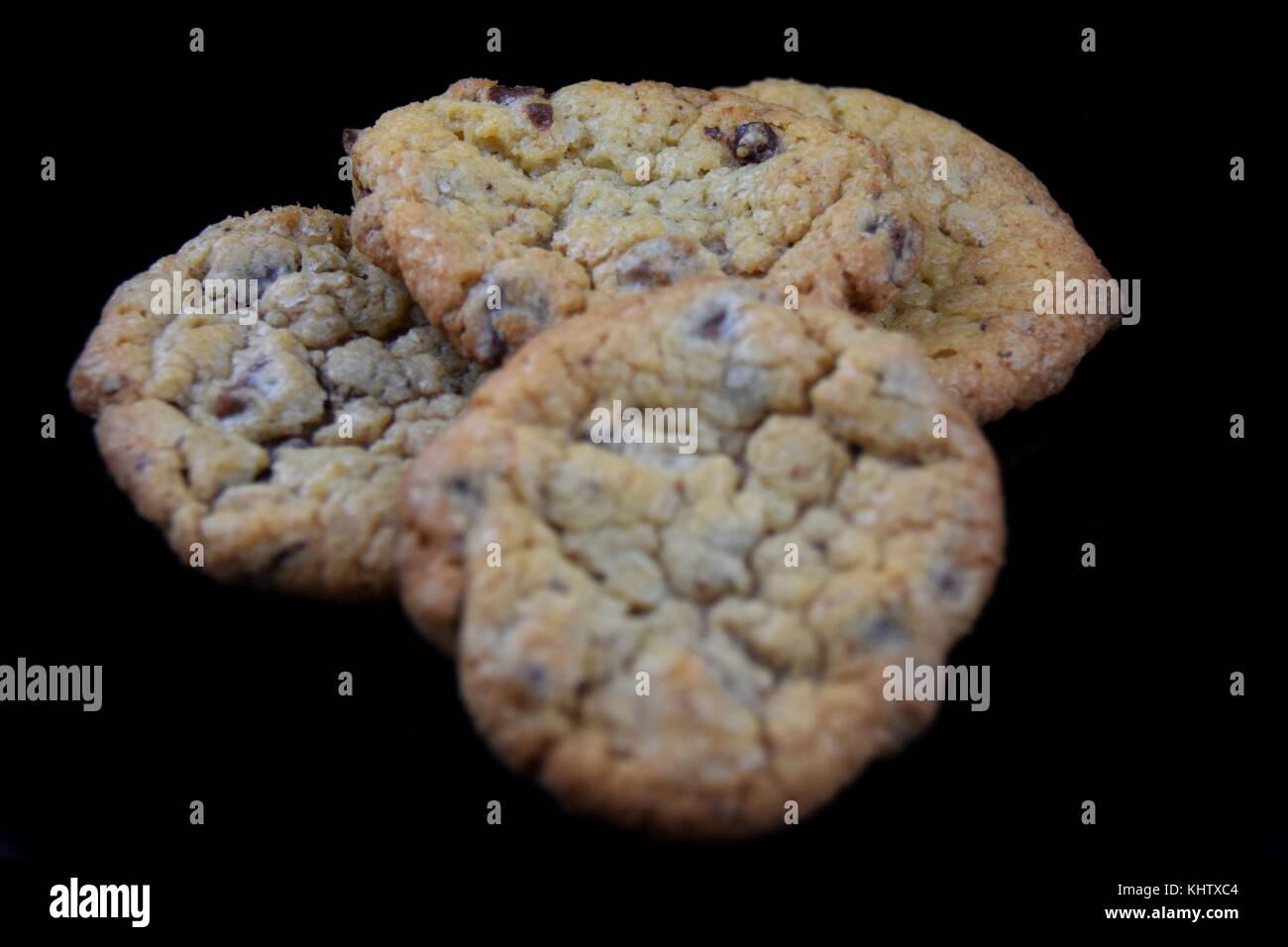 dark chocolate Cookies in contrast on a dark background Stock Photo - Alamy
