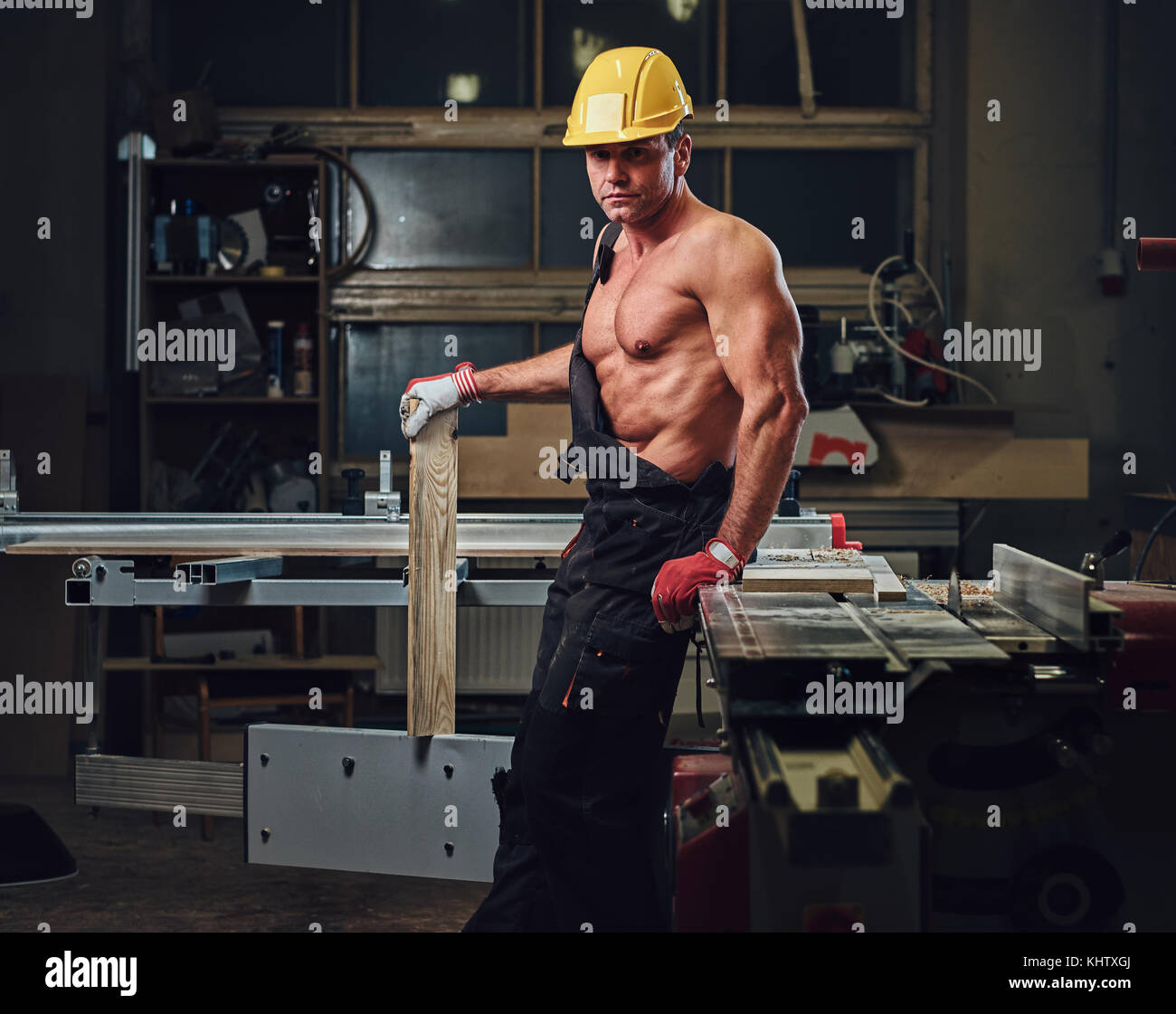 Portrait of shirtless muscular carpenter Stock Photo - Alamy