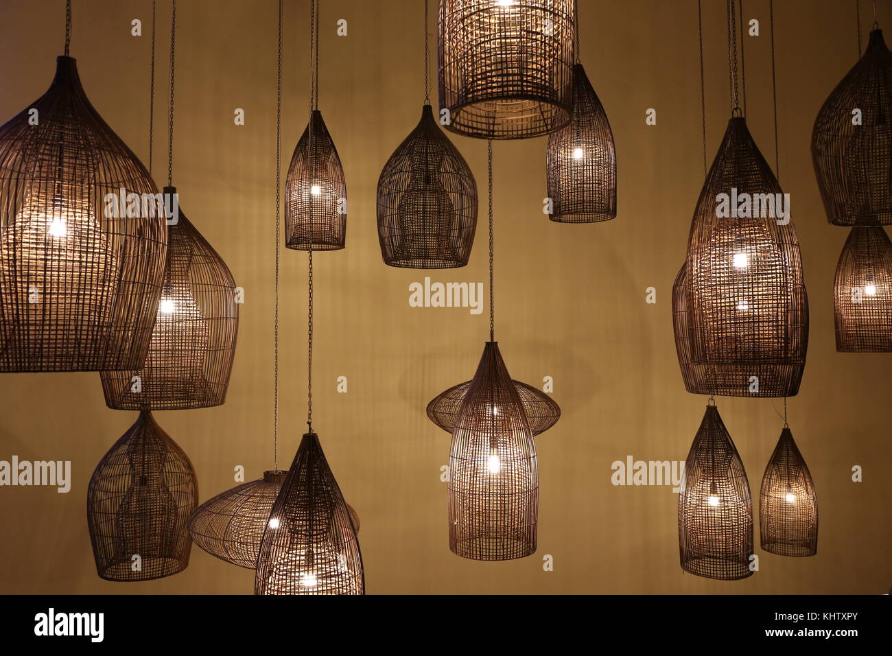 Many lighted lamps suspended Stock Photo - Alamy