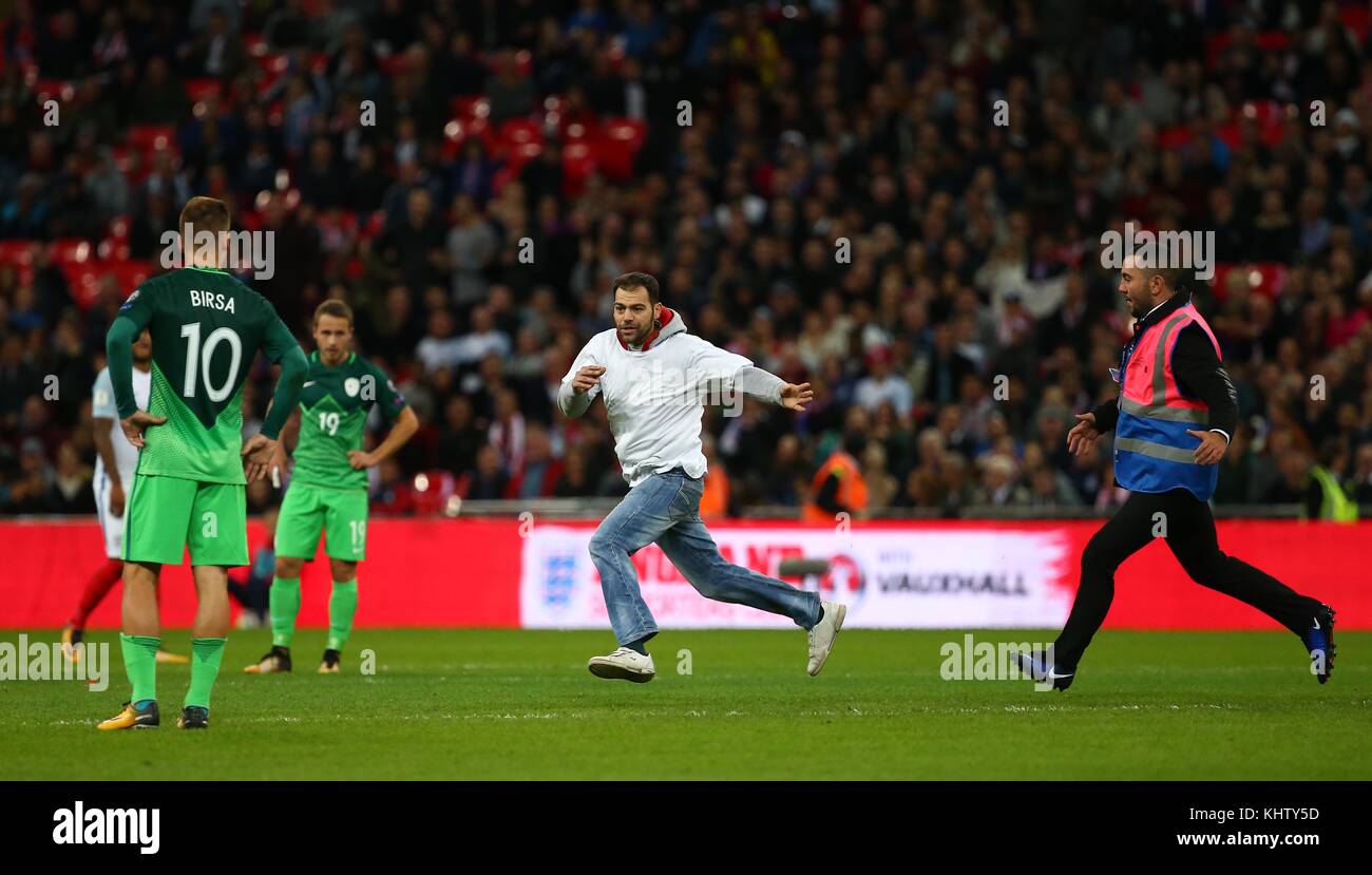 A pitch invader during the FIFA World Cup Qualifier match between ...