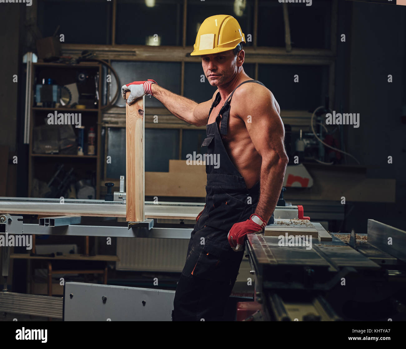 Portrait of shirtless muscular carpenter Stock Photo - Alamy