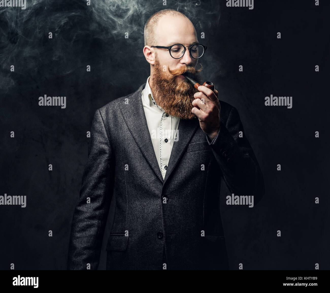 A man smoking tradition pipe Stock Photo - Alamy