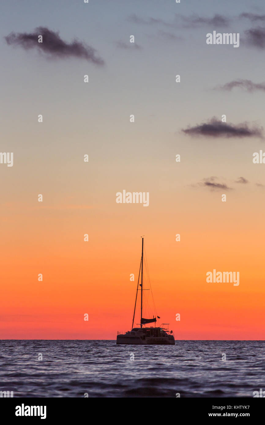 Silhouette boat sailing in sea sunset boat hi-res stock photography and ...