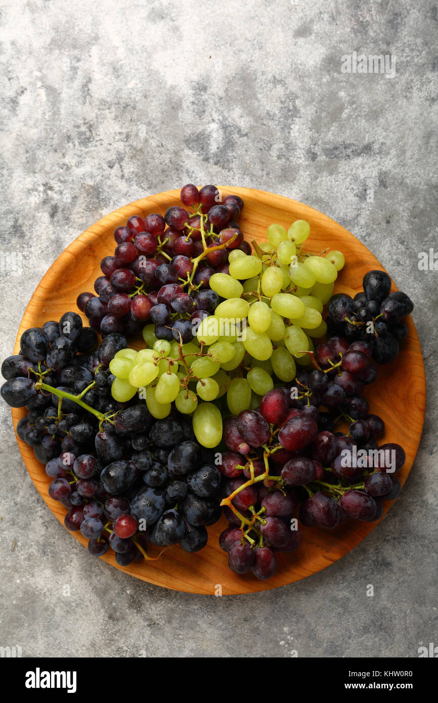 Fresh organic grapes mix on plate, food above Stock Photo - Alamy